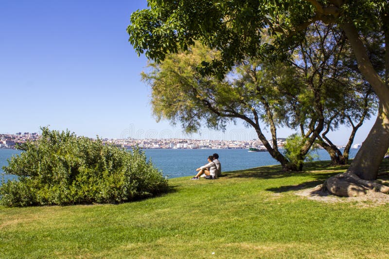 People at Riverside Park Looking at View Stock Image - Image of seated ...