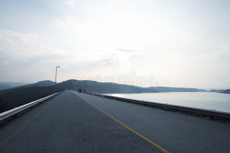 People on the road dam stock image. Image of power, road - 45867617