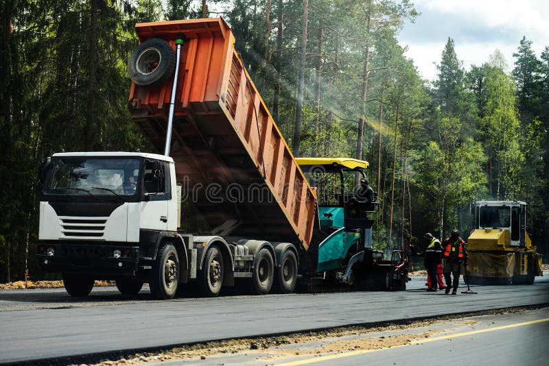People on Road Equipment Build a Concrete Road Pavement Stock Photo ...
