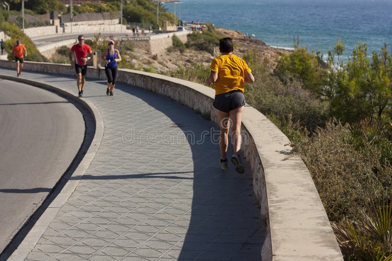 People Running Along the Beach by the Ocean. Editorial Image - Image of ...