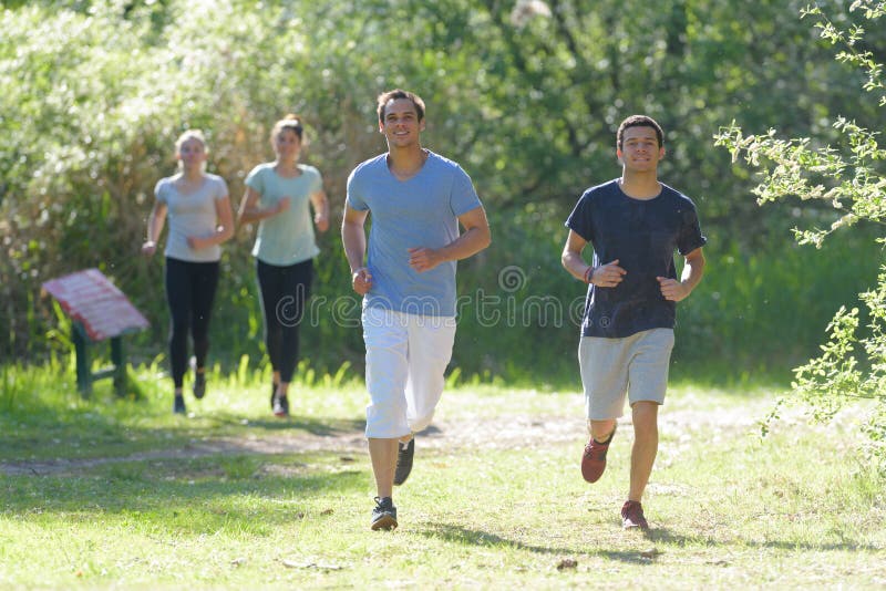 People Running on Jogging Track in Park Stock Photo - Image of energy ...