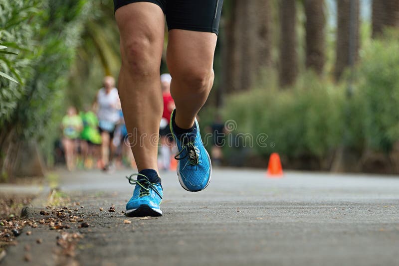 People running in the park stock photo. Image of outdoor - 74797878