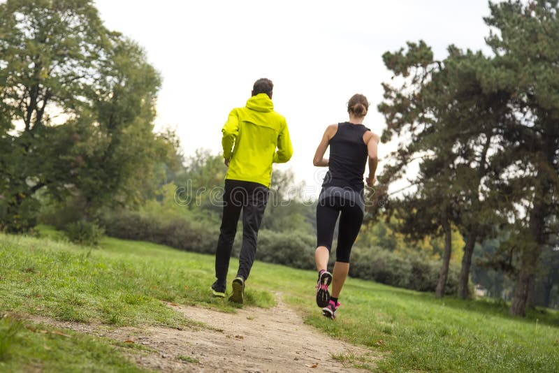 People running in the park stock image. Image of female - 63771409