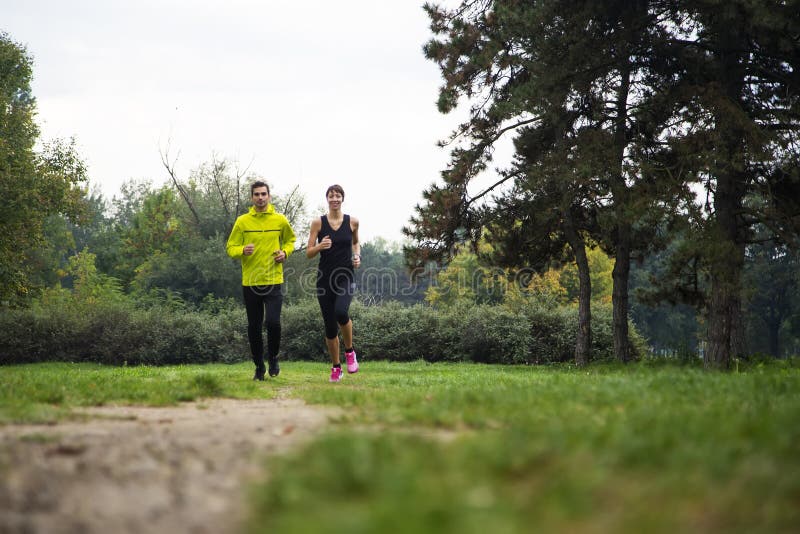 People running in the park stock image. Image of young - 63771427