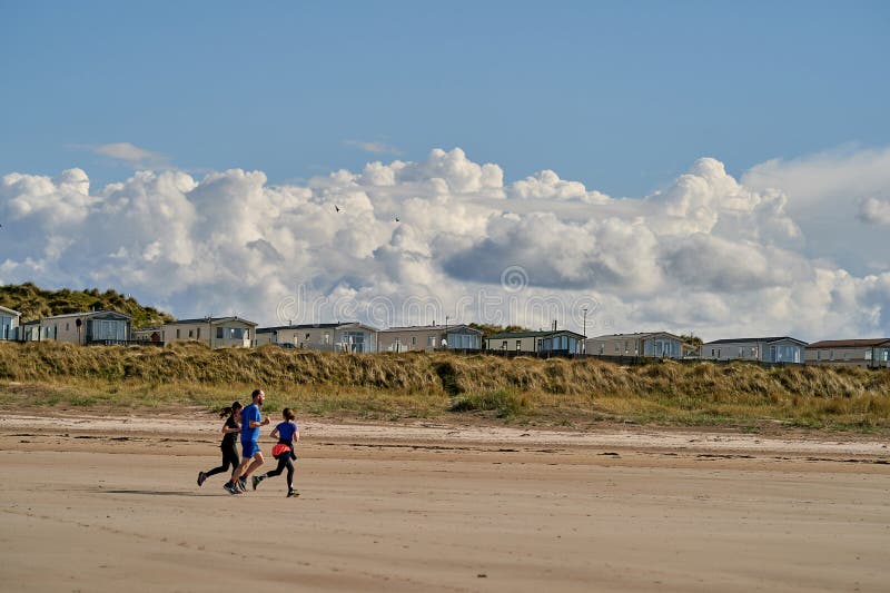 People Running Playing Relaxing on the Beach Editorial Stock Photo ...