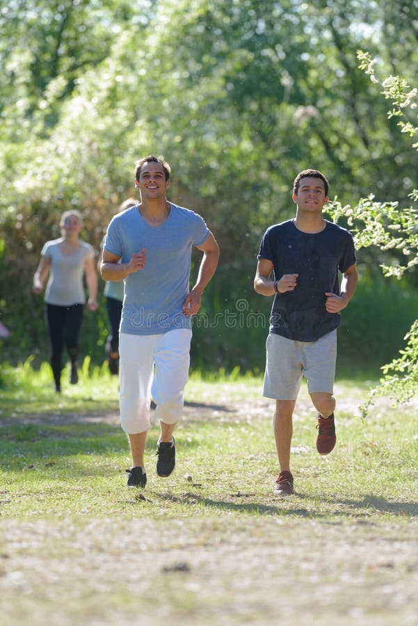 People Running in Sunny Day Stock Photo - Image of together, running ...