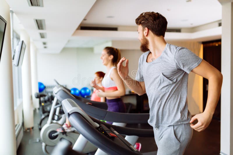 People Running on Treadmill in Gym Stock Photo - Image of machine ...