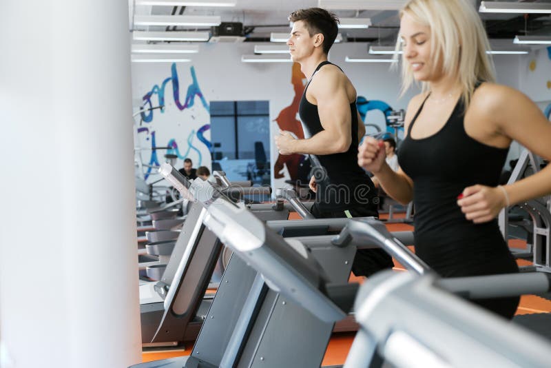 People Running on Treadmills in Gym Stock Image - Image of exercise ...