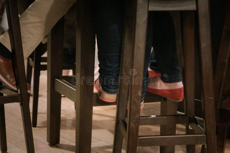 People `s feet stock photo. Image of cafeteria, jeans - 116335988