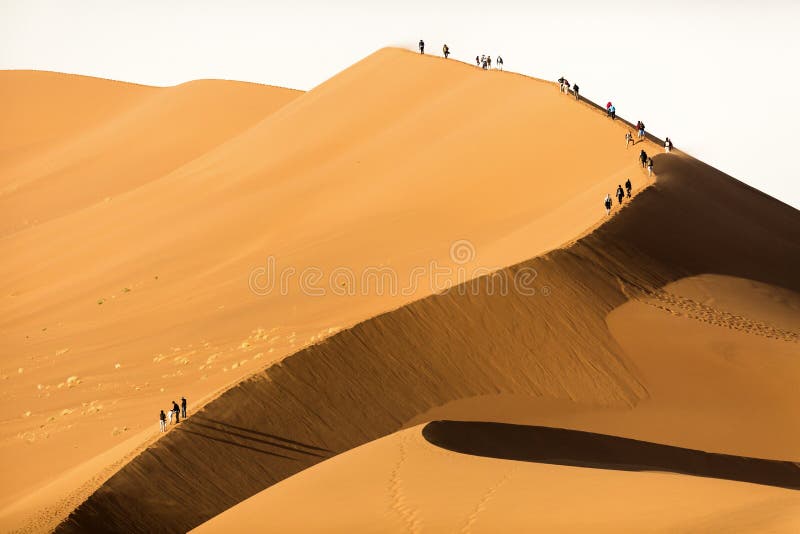 People on a sand dune editorial photo. Image of tanzania - 200137911