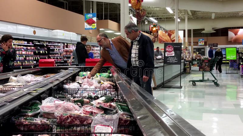 People Selecting Meat in Grocery Store Stock Footage - Video of people ...