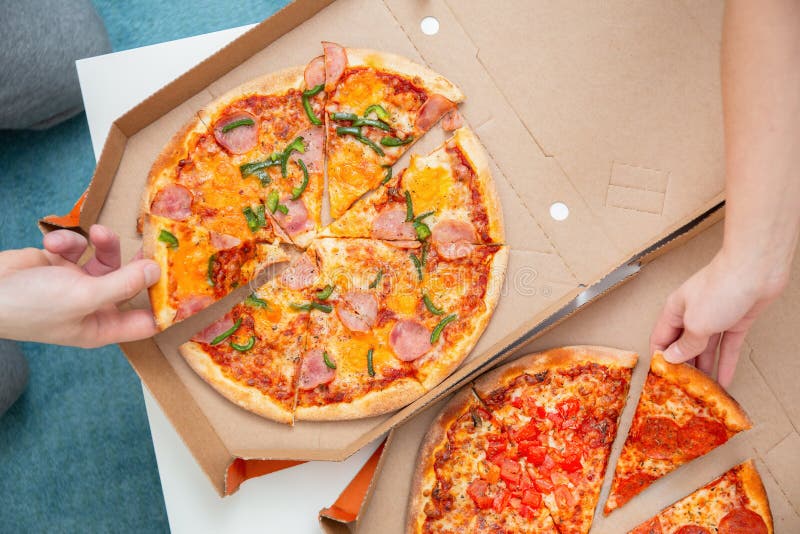 People Sharing Pizza from Delivery Boxes Stock Image - Image of ...