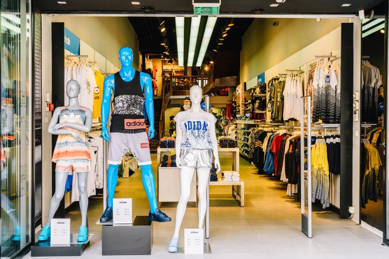 People Shopping and Browsing in Local Clothes Store Editorial Stock ...