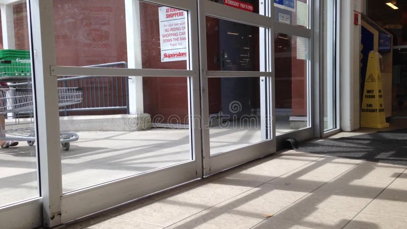 People Walking Through Door At Main Entrance Stock Footage - Video of ...