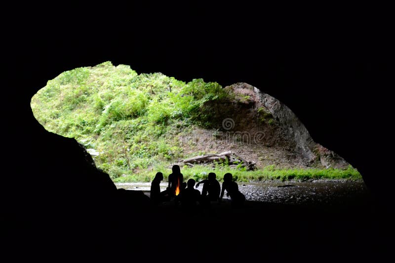 People Sitting Round the Fire in a Cave Stock Photo - Image of male ...