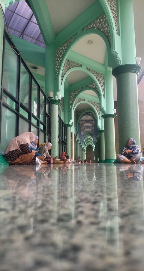 People sit in mosque aisle editorial photo. Image of masjid - 265156016