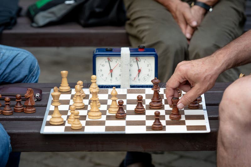 People Sit in the Park on Benches and Play Chess. Stock Photo - Image ...
