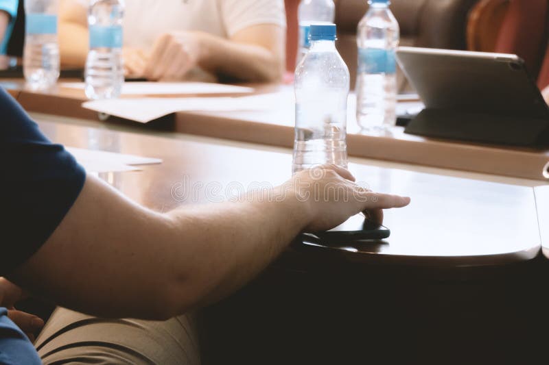 People Sit at the Table Facing Each Other Stock Photo - Image of ...