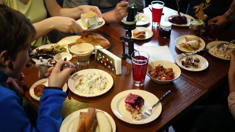 People Sits at the Big Table in the Cafe and Stock Video - Video of ...