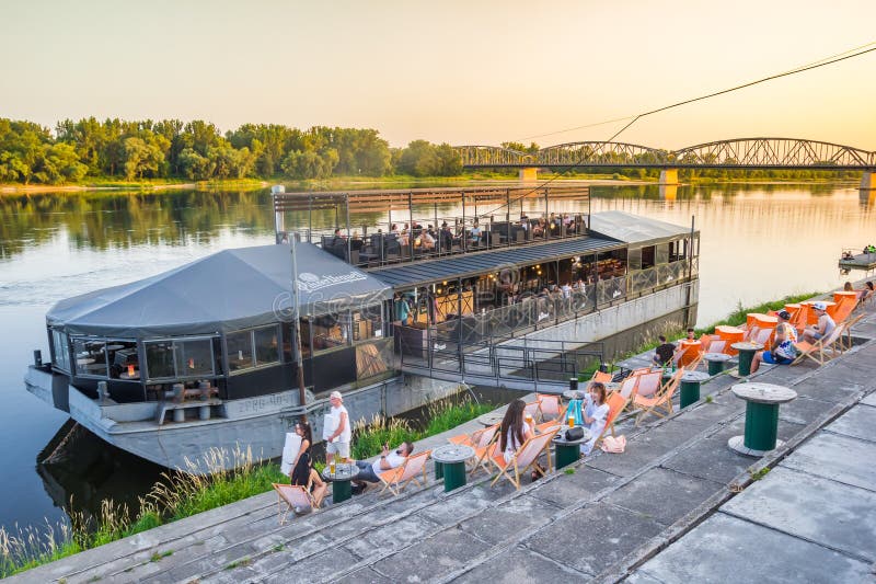 People Sitting and Drinking at a Cafe Boat in the Wisla River in Torun ...