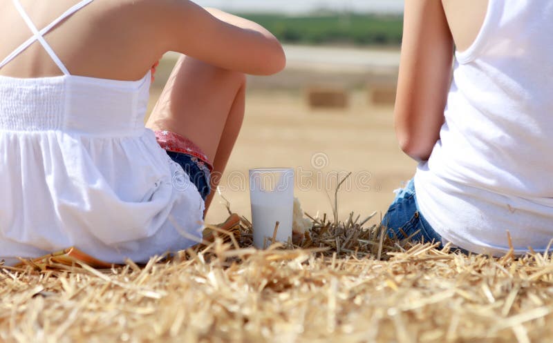 People sitting on hay stock image. Image of childhood - 26622769