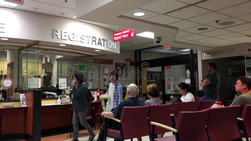 People Sitting in a Hospital Emergency Registration Area Stock Video ...