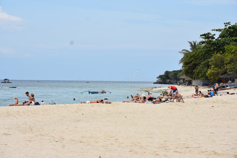 A People Sitting on Sandy Beach Editorial Photo - Image of comfortable ...