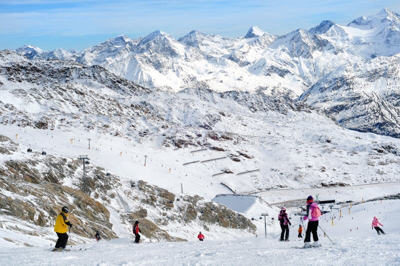 People Skiing in European Alps. Scenic View. Stock Photo - Image of ...