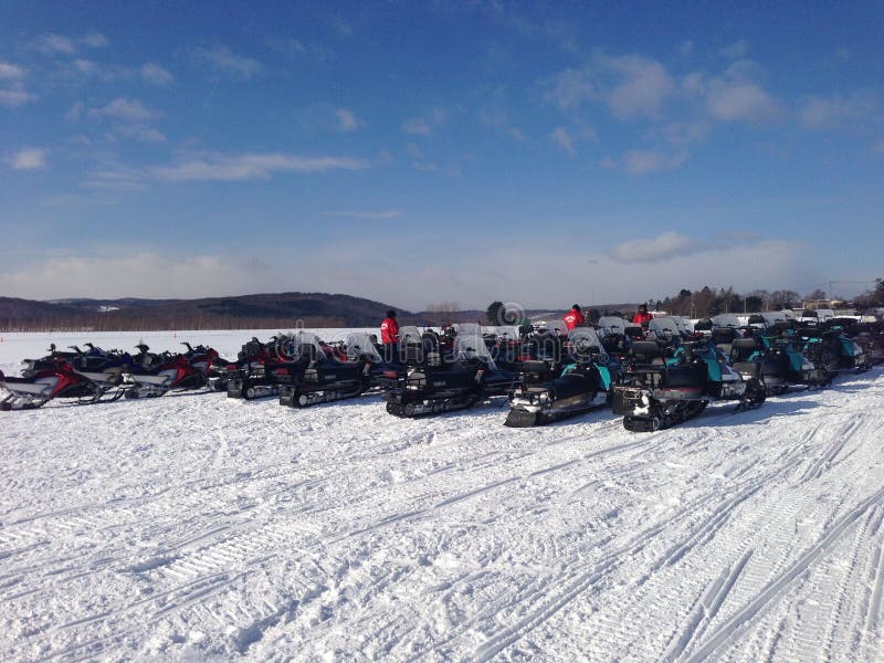 People with Snowmobiles in the White Field in Winter. Editorial Stock ...