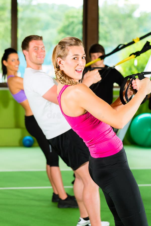 People in Sport Gym on Suspension Trainer Stock Image - Image of figure ...