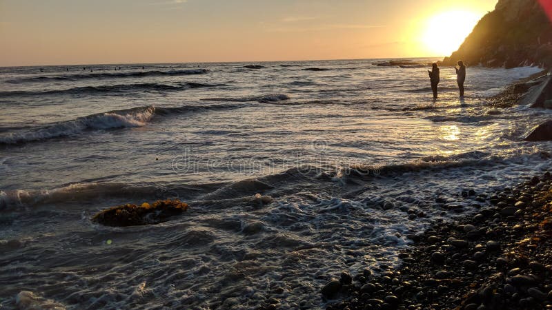 2 People Standing on Beach at Sunset Stock Image - Image of california ...