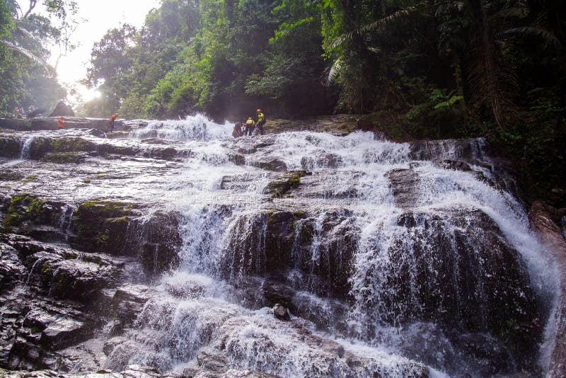 2 People Standing in the Top of a Waterfall in the Tropical Forest ...
