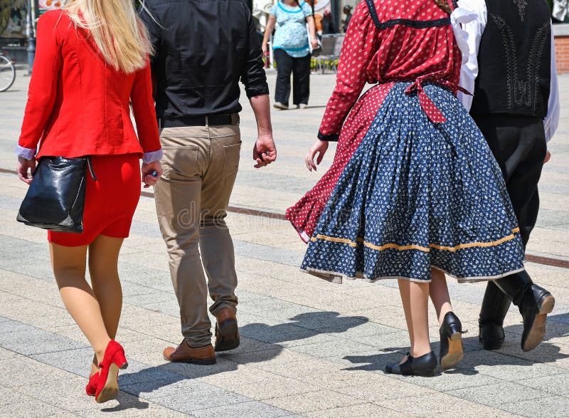 People on the Street in Regular and Traditional Clothing Stock Image ...
