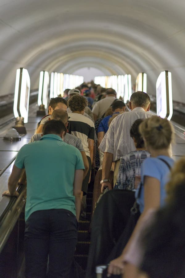 People in the Subway on the Escalator. a Crowd of People on the Stairs ...