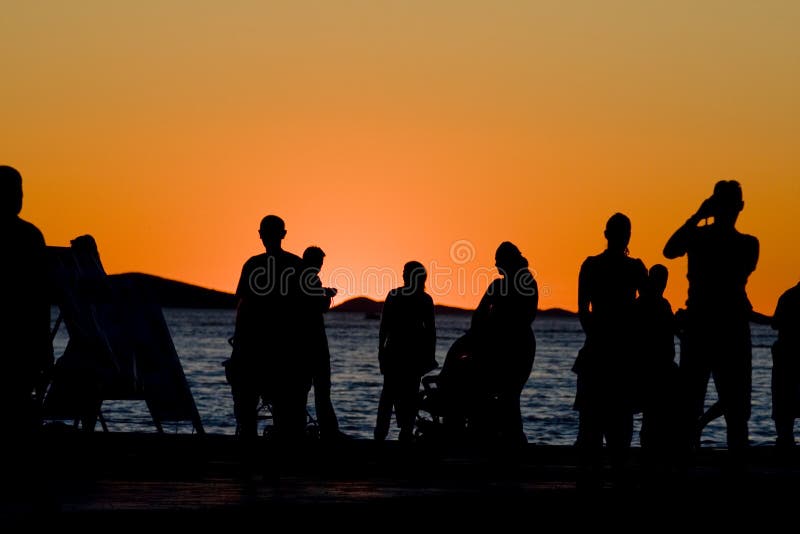 People at sunset stock image. Image of sunset, night, water - 6905599