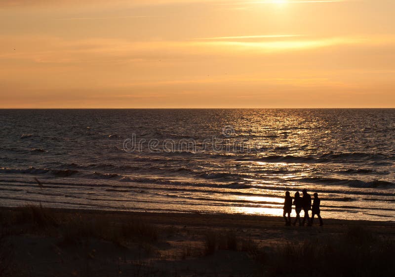 People on the sunset beach stock photo. Image of people - 30720862