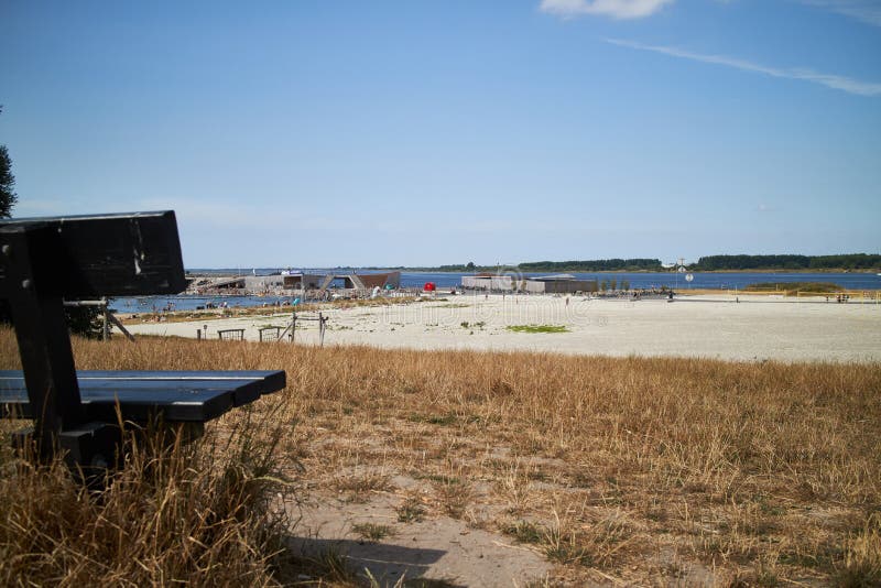People Swimming in the Pier by the Sandy Beach Stock Image - Image of ...