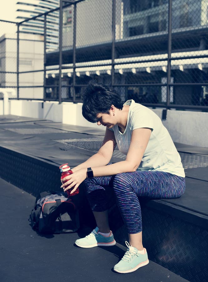 People Taking a Break from Exercise Session Stock Image - Image of ...