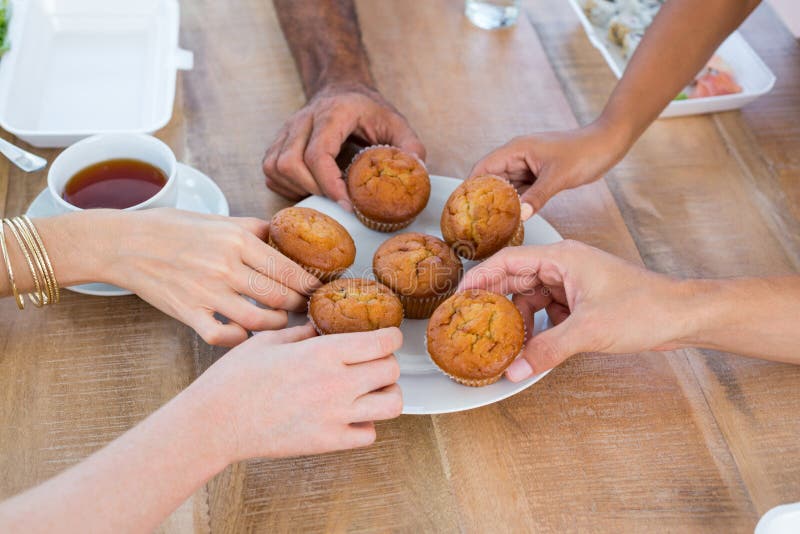 People taking a cupcake stock photo. Image of cake, casual - 54773388