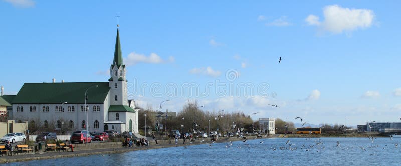 People Taking a Rest at the Lakeside Stock Photo - Image of church ...