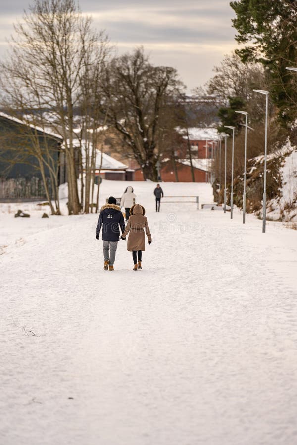 People Taking Sunday Walk in a Snowy Park.. Stock Photo - Image of ...