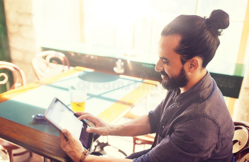 Man with Tablet Pc Drinking Beer at Bar or Pub Stock Photo - Image of ...