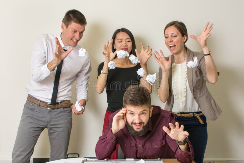 People Throwing Papers on a Colleague Stock Image - Image of people ...