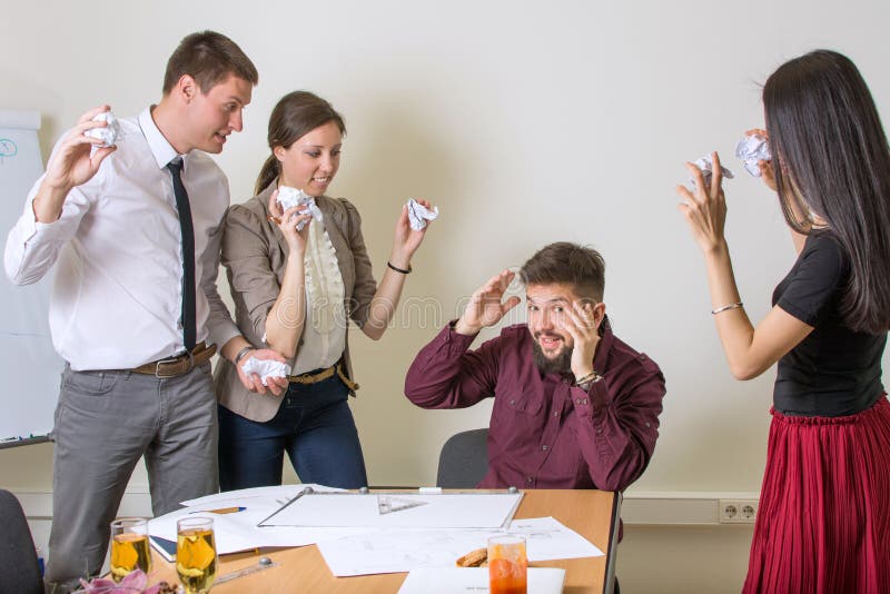 People Throwing Papers on a Colleague Stock Image - Image of people ...