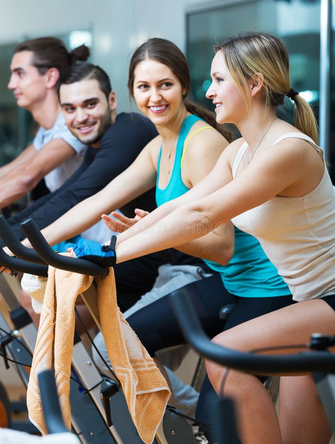 People Training on Exercise Bikes Stock Image - Image of exercycle ...