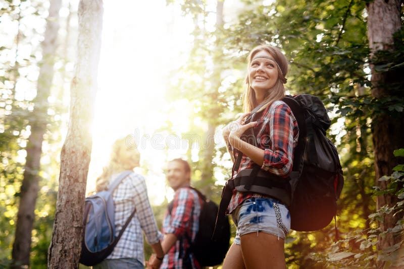 People trekking in forest stock image. Image of leisure - 73626497