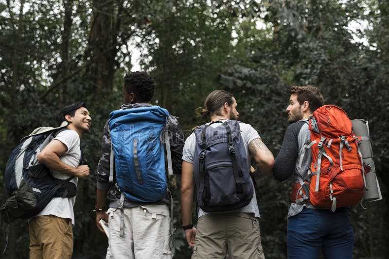 People Trekking Together in a Forest Stock Image - Image of adventure ...