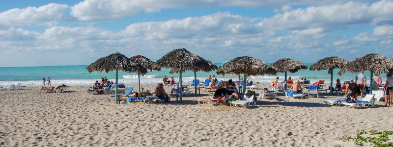 People Under the Sun Loungers of Cane Resting on the Beach Editorial ...