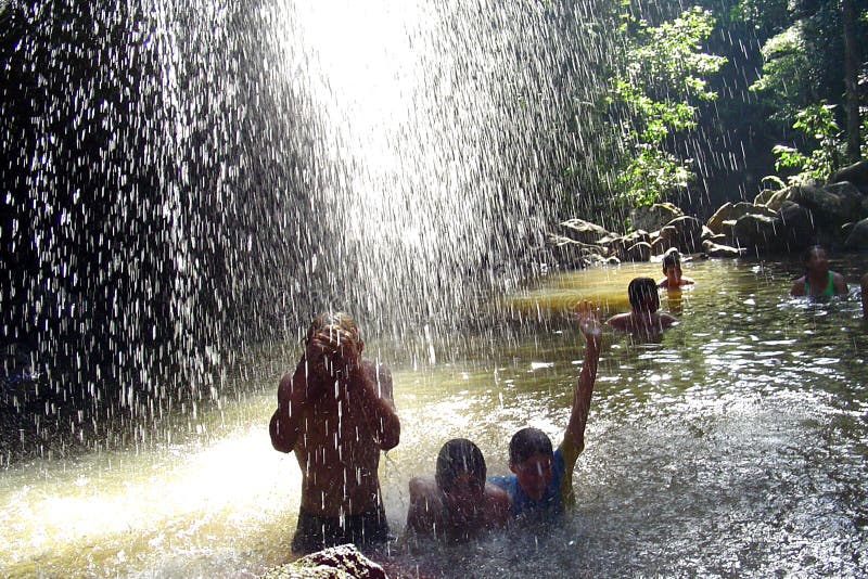 People Under Waterfall stock photo. Image of light, rainforest - 62358