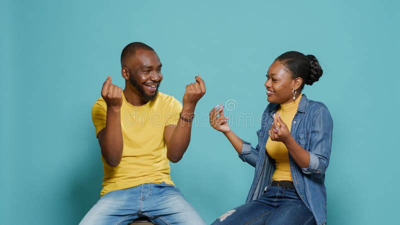 People Using Body Language To Do Money Gesture with Hands in Studio ...